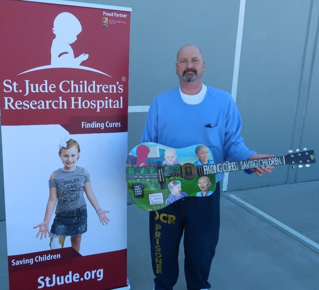 Guitars hand-painted at Pelican Bay net $11k for children